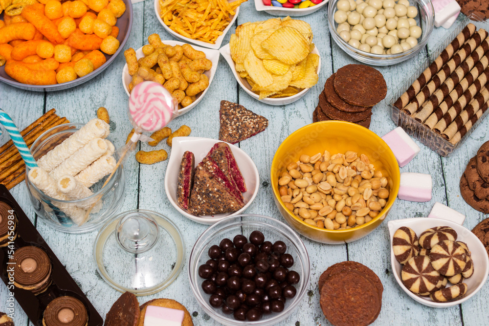 Salty and sweet snacks. Table of salty and sweet snacks. Large group of ...