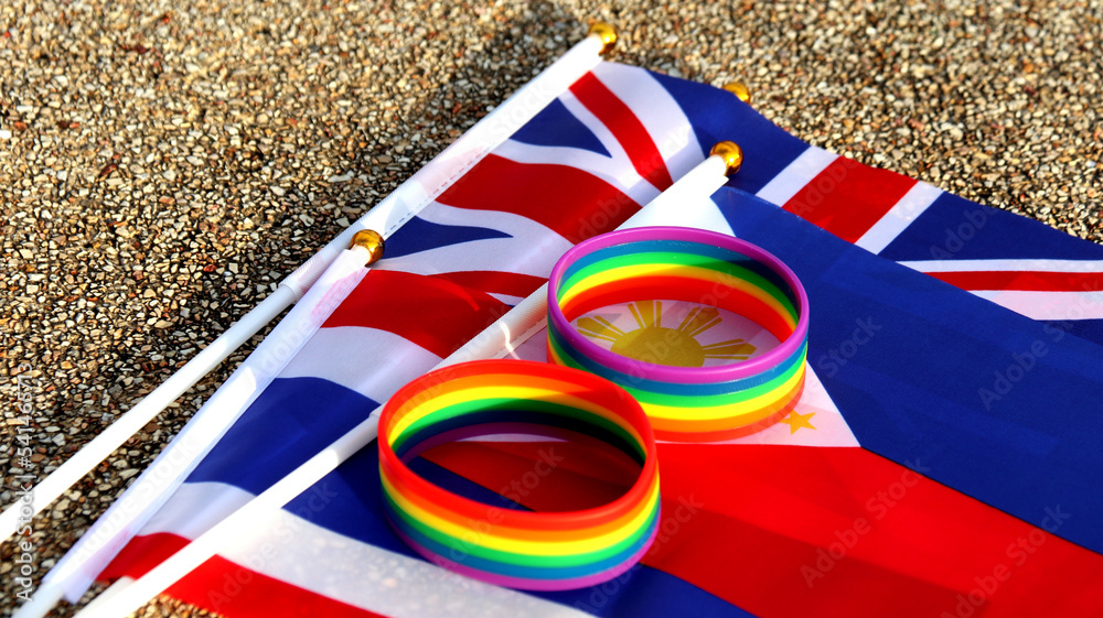 LGBTQ flag with countries flags are put on the floor with lgbt wrist ...