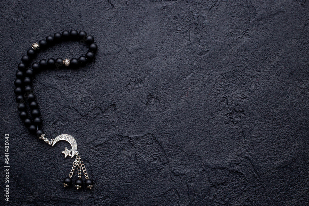 Black Muslim rosary with silver crescent moon. Islamic background Stock Photo | Adobe Stock