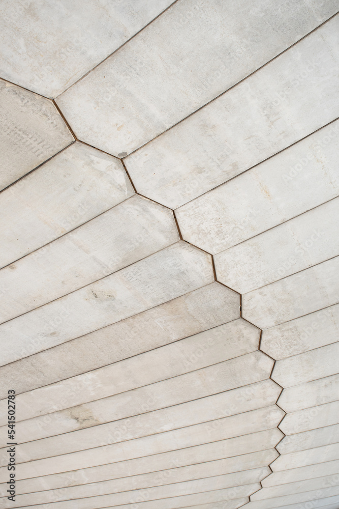 Large modern concrete ceiling structure with graphic lines and ...