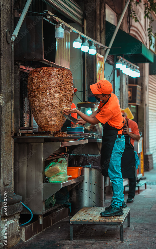 Mexican taquero working doing tacos Stock-Foto | Adobe Stock