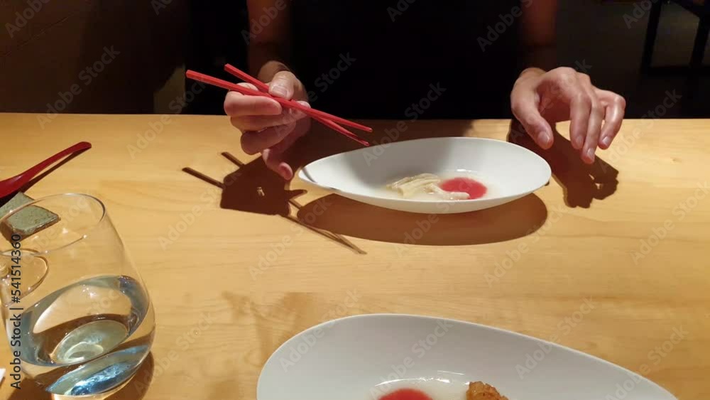 woman eats japanese food delicacies sushi nigiri haute cuisine select ...