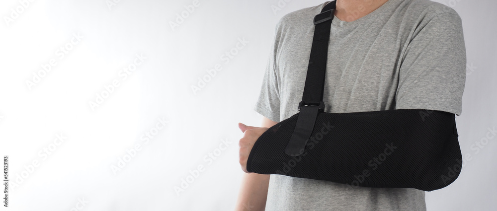 Broken arm. Arm Sling therapy support and covered around elbow first ...
