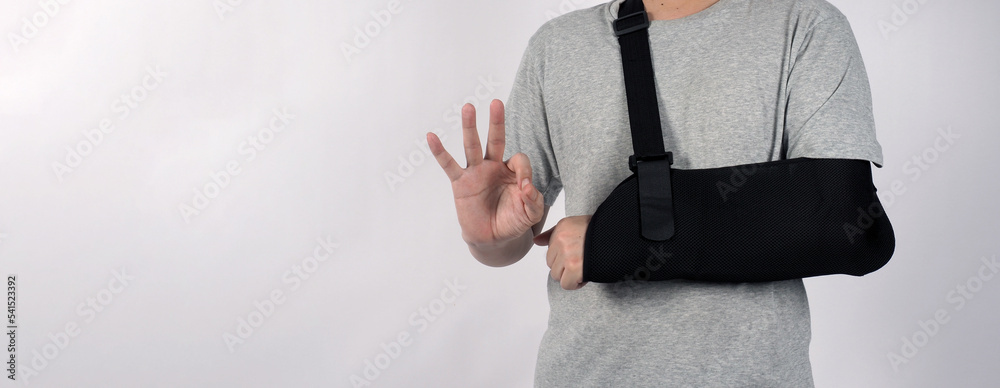 Broken arm. Arm Sling therapy support and covered around elbow first ...