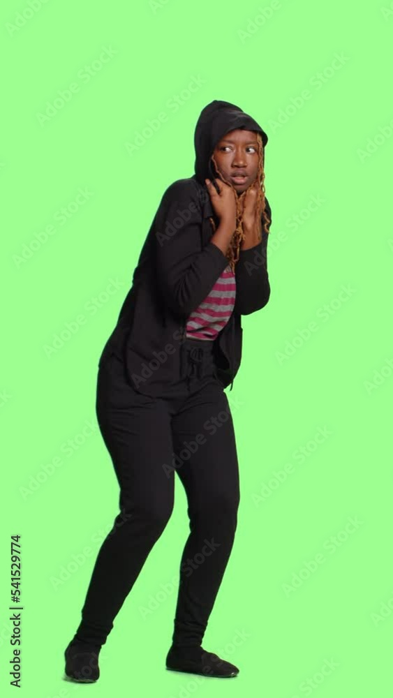 Vertical video: Young adult acting scared and anxious with full body ...