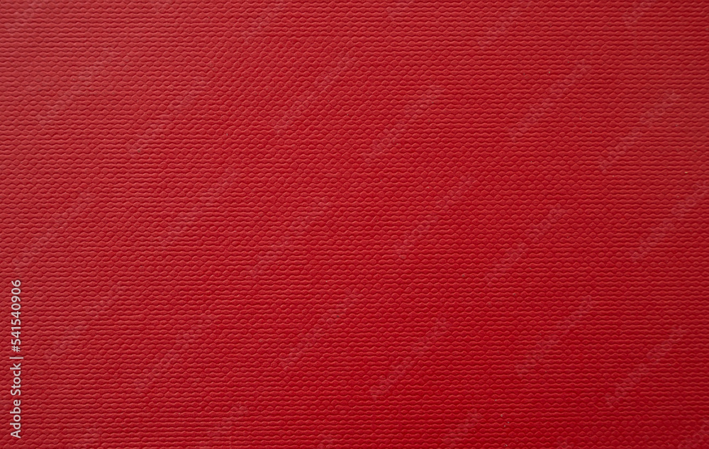 Blank red cardboard with cell pattern as background, bright red surface ...