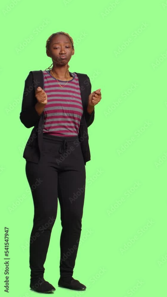 Vertical video: Happy funny girl fooling around with dance moves over ...