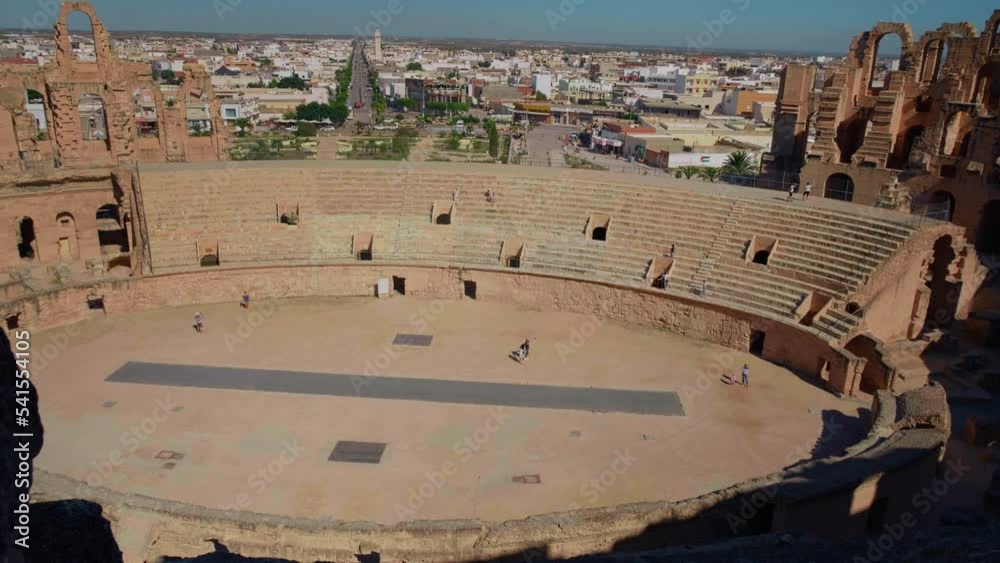 Ruins of Amphitheatre of El Jem with arena, columns and brick walls ...
