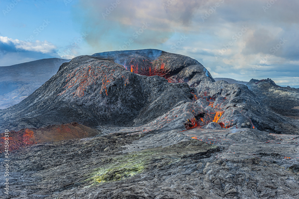 Volcanic crater in the day with sunshine. active volcano after eruption ...