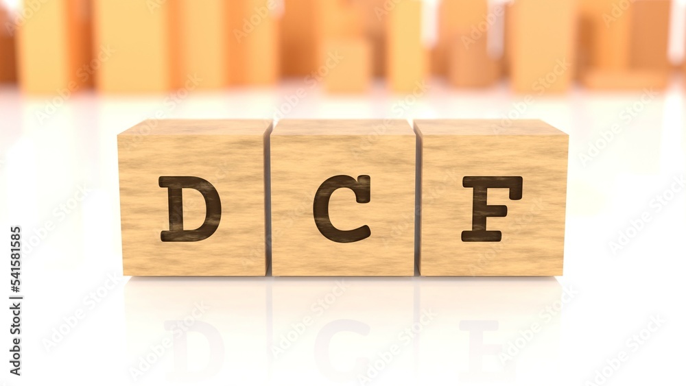 Word DCF engraved on wooden cubes reflected on the bright surface ...