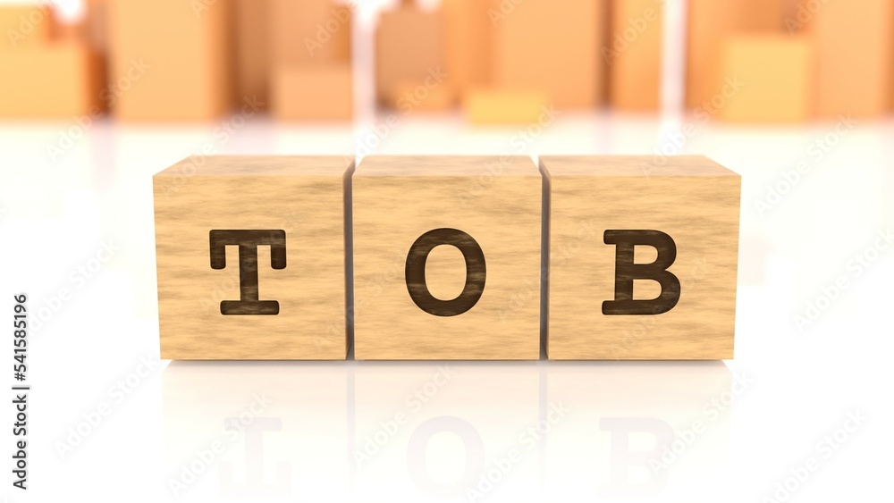 Letters TOB branded on wooden cubes reflected on the bright surface ...