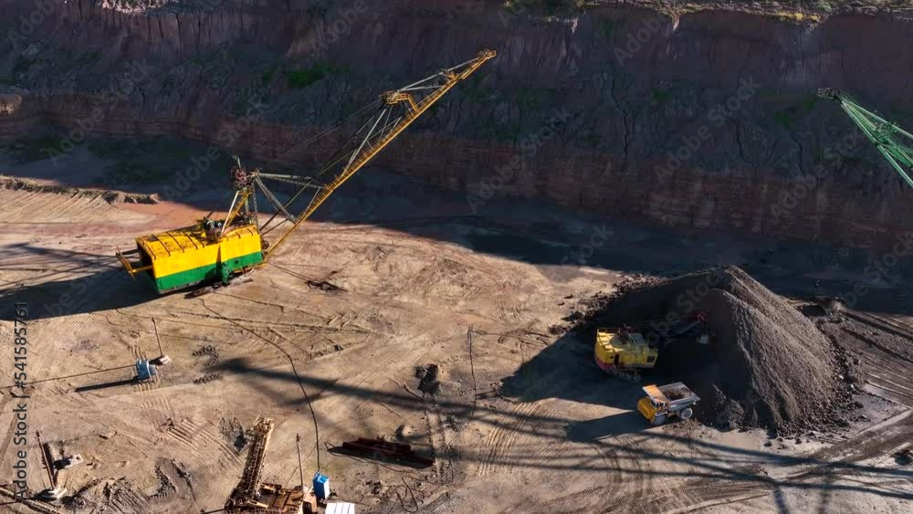 Mining excavator load dolomite minerals in haul truck. Limestone mining ...