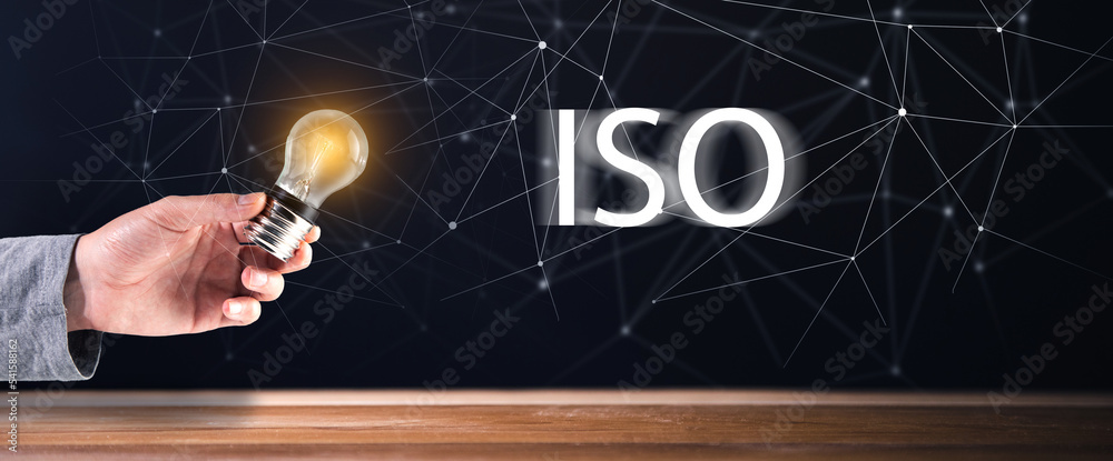 ISO and light bulb in hand Stock Photo | Adobe Stock