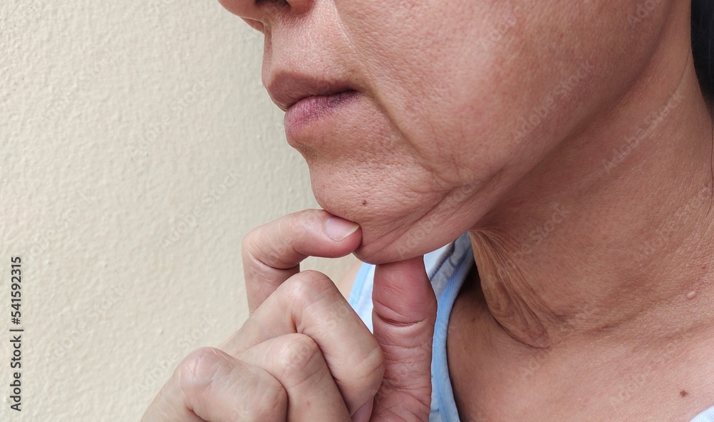 portrait showing the fingers squeezing under the chin, Wrinkles and ...