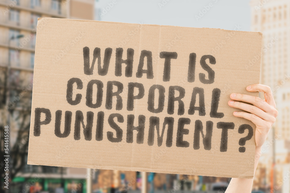 The question " What is corporal punishment? " is on a banner in men's ...