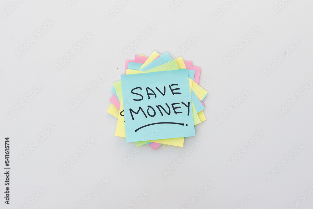 Save money text hand written on a sticky note with isolated white ...