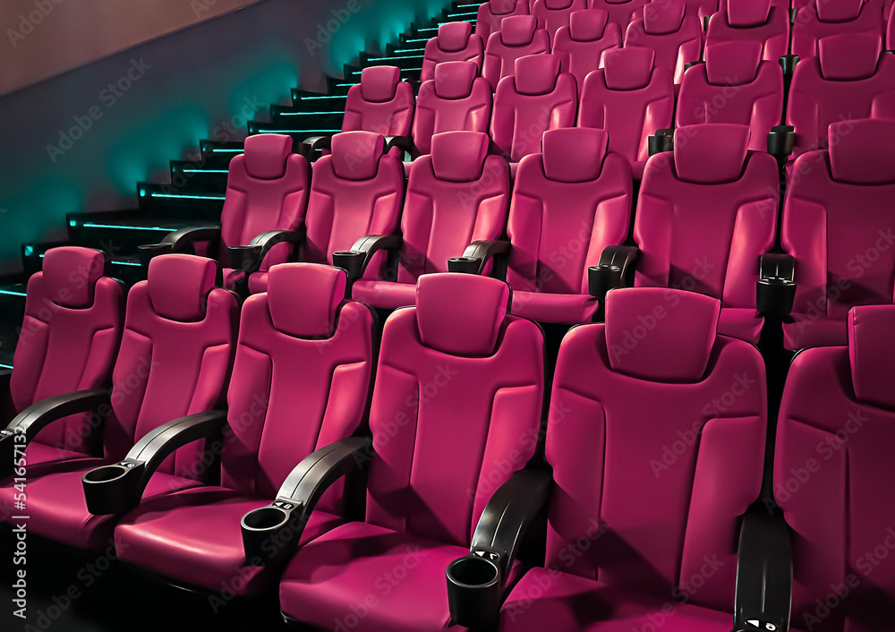 Foto de Cinema and entertainment, empty pink movie theatre seats for tv ...