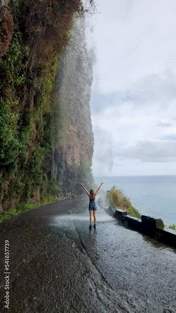 Cascata dos Anjos - woman standing under Angels waterfall in Madeira ...