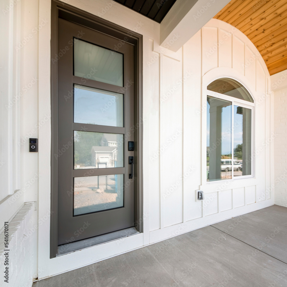 Square Exterior of a house with white board and batten sidings Stock ...