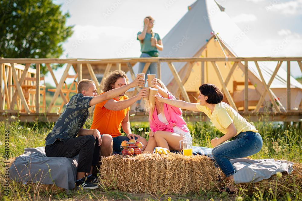 Happy and excited group of friends have a good time together in the ...