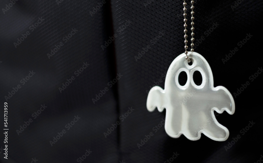Key chain reflective in a ghost pattern form on black background ...