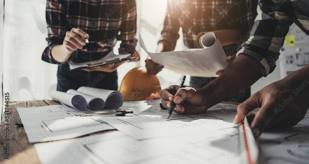 Team of engineer and architects working join hands to build successful ...