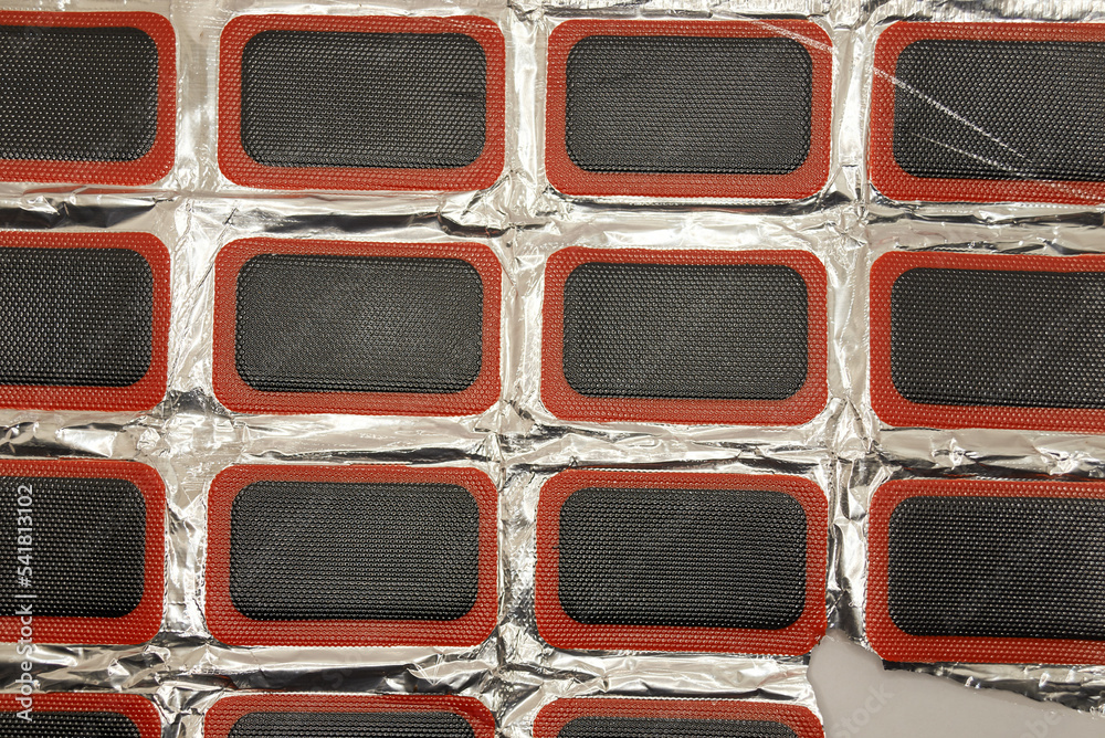 Texture of a series of black square rubber patches Stock Photo | Adobe ...