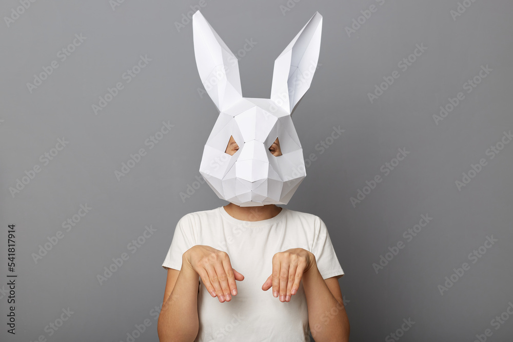 Portrait of funny unknown female wearing bunny mask and white t-shirt ...
