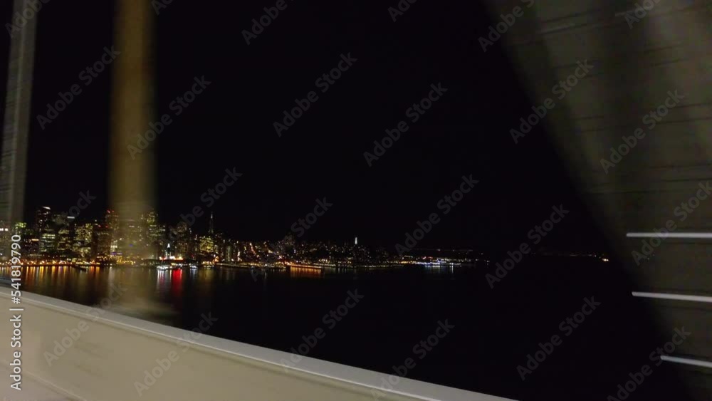 Point Of View Of Illuminated City Seen From Bridge Over Sea At Night ...