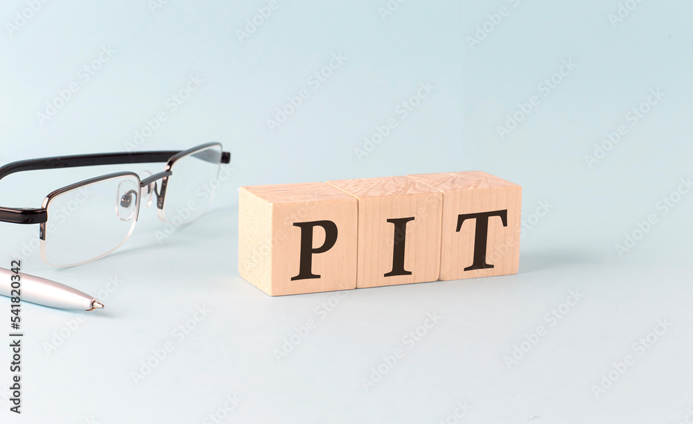 Text PIT - written on the wooden cubes on blue background Stock Photo ...