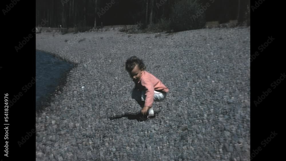 Throwing Rocks 1963 - A young girl throws rocks into Jackson Lake in ...