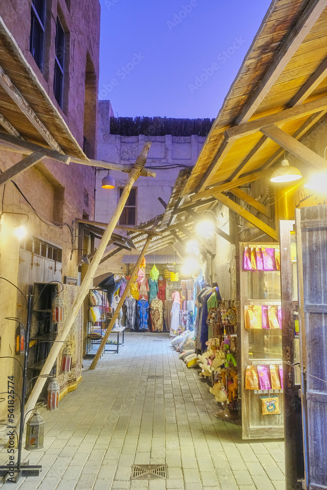 Old Dubai buildings and traditional Arabian market night view ...