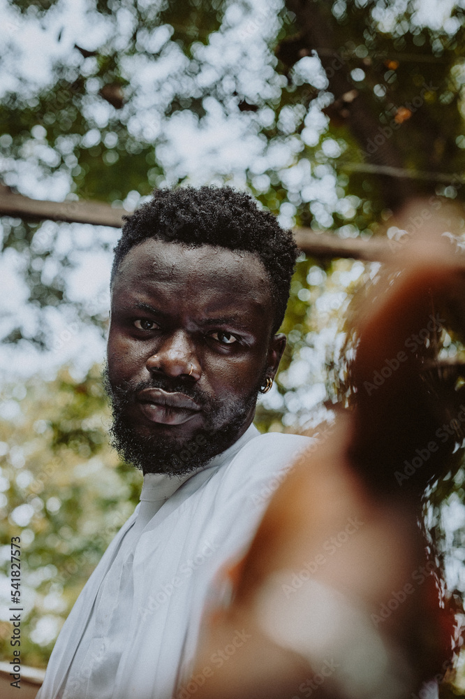 a black man reaching out to the camera Stock Photo | Adobe Stock