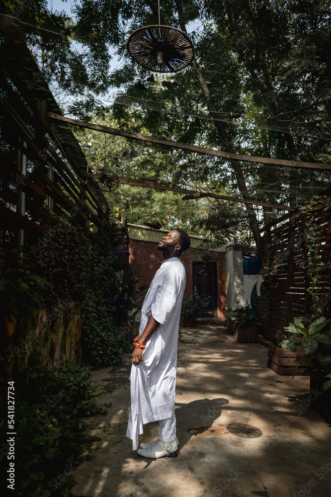 a black man standing basking in the sun Stock 写真 | Adobe Stock