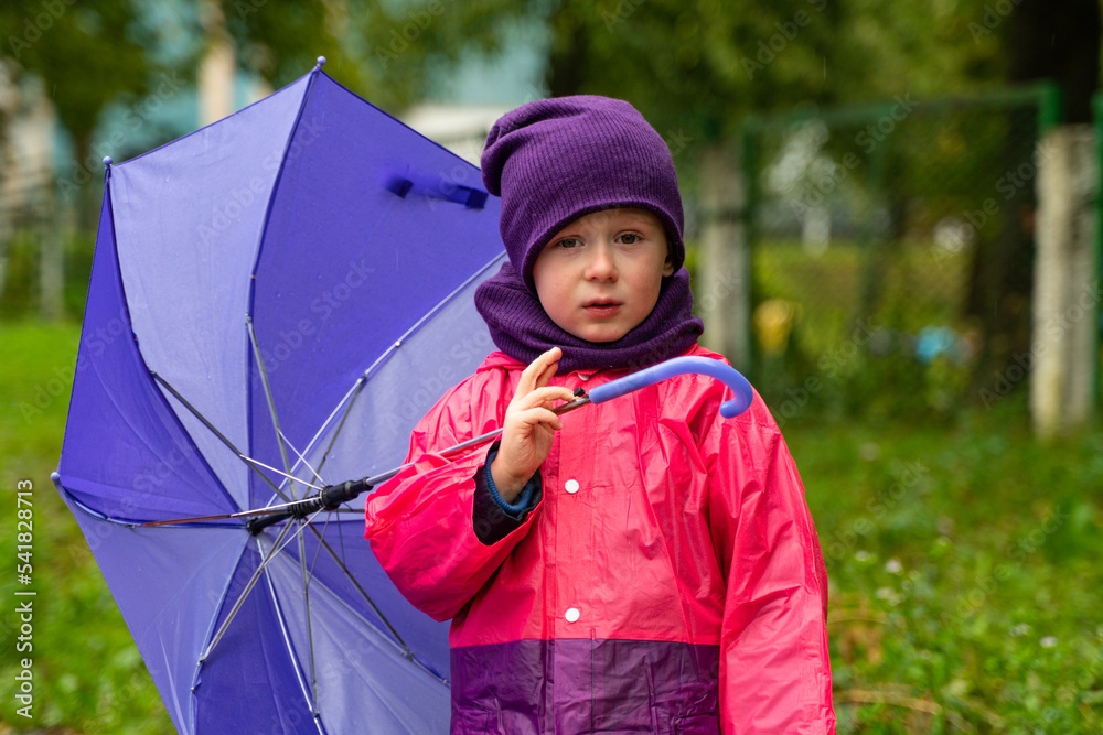 Child playing in autumn rain. Kid with umbrella. Outdoor fun for kids ...