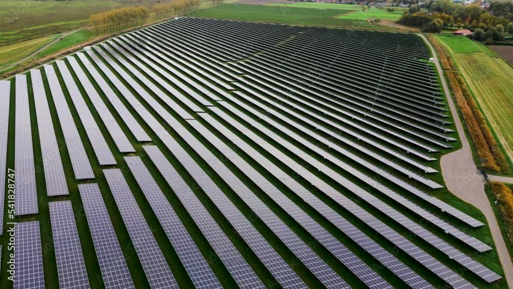 4K. Aerial view of Solar panel farm or solar power plant. Alternative ...