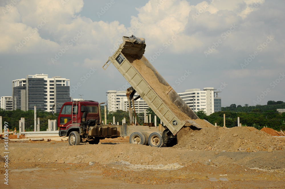 JOHOR, MALAYSIA -APRIL 13, 2016: Construction lorry. Offloading of a ...