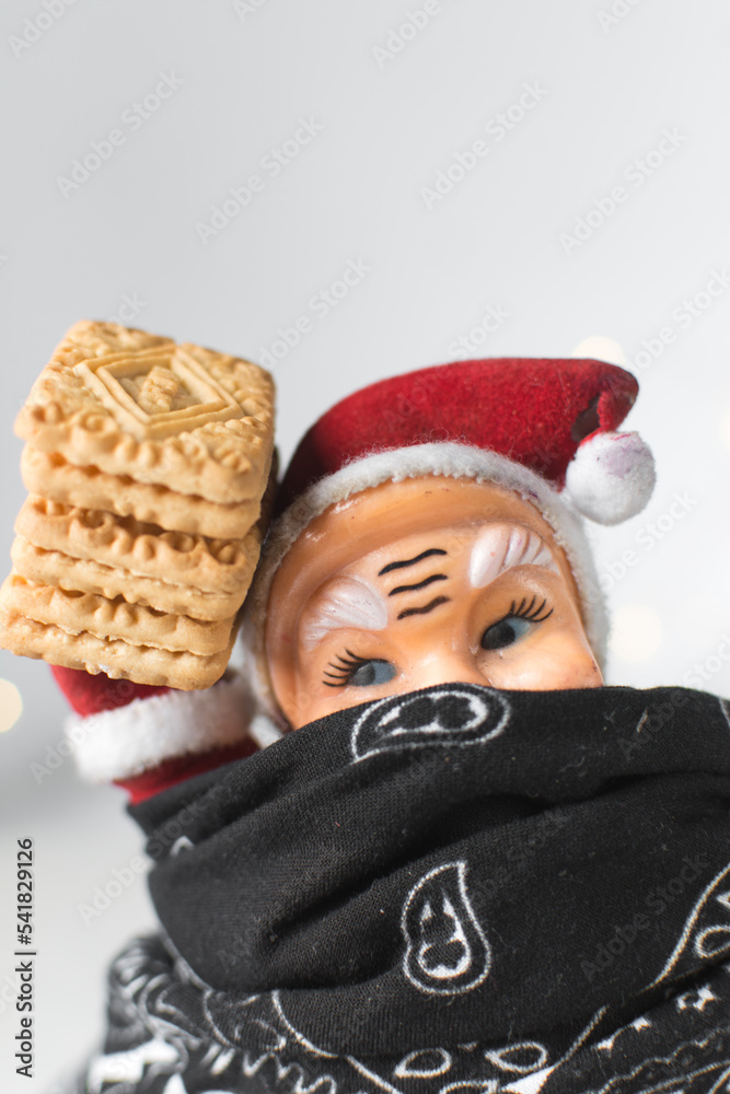 Santa the cookie thief, santa with a bandana covering his face holding ...