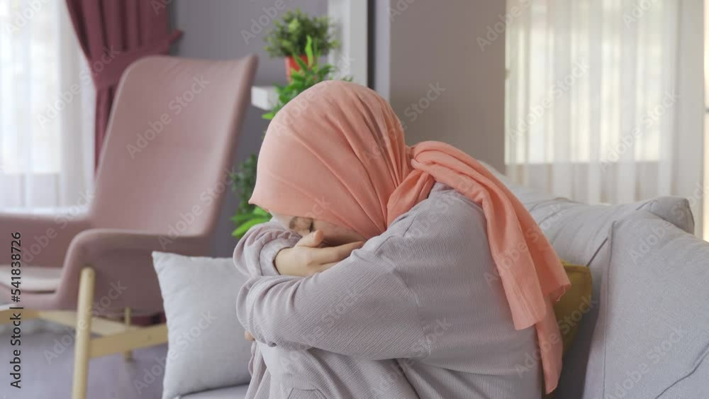 Muslim Arab teenage girl is crying and sad at home. Muslim young girl ...