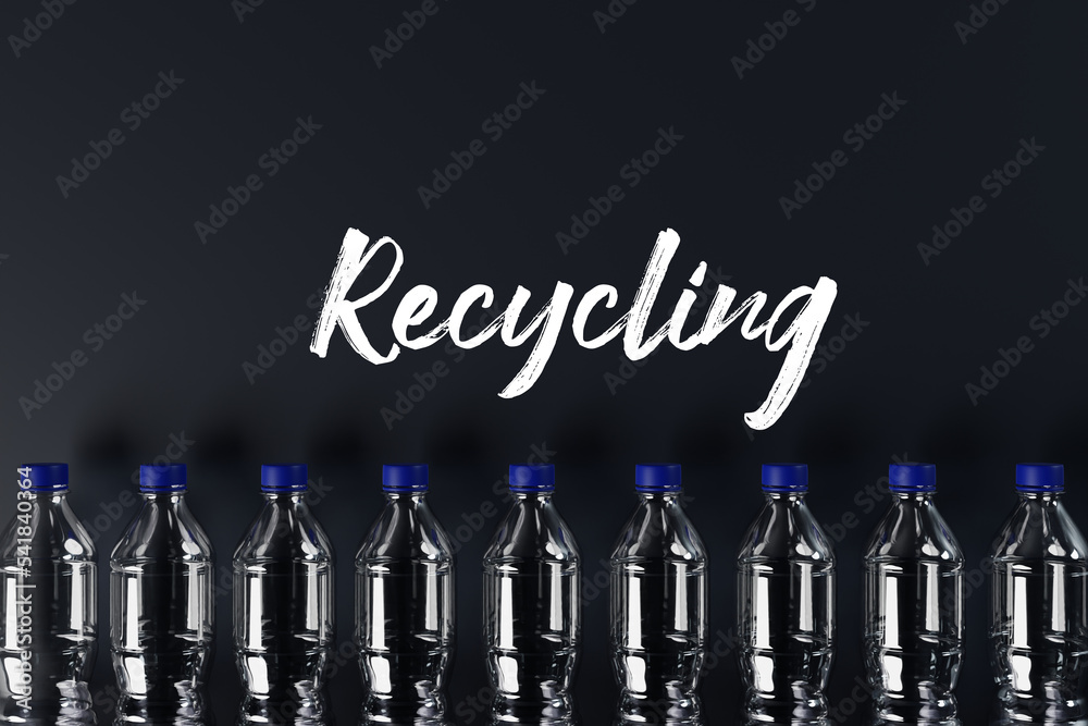 Plastic bottles with the recycling icon and painted recycling arrows ...
