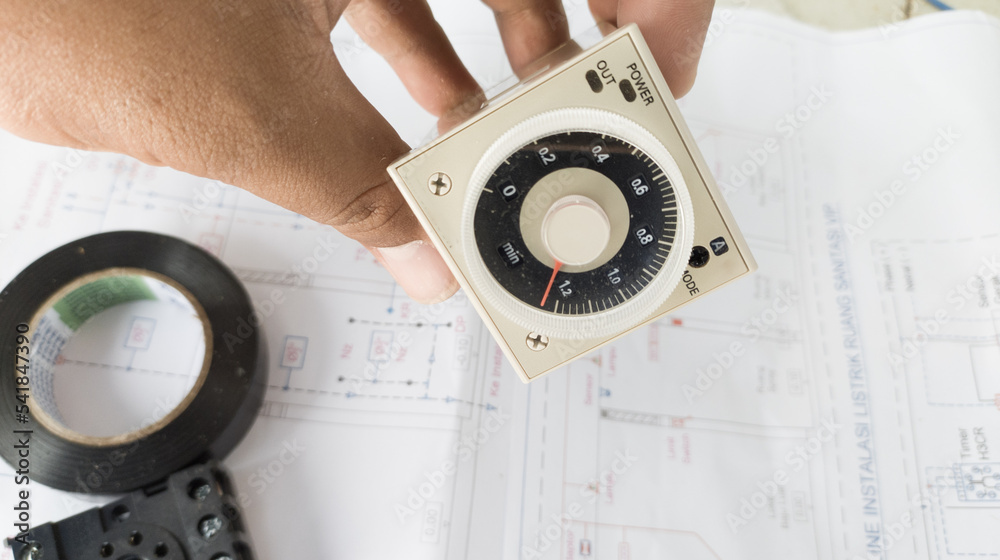 The close up Electric timer with electric diagram background. Stock ...