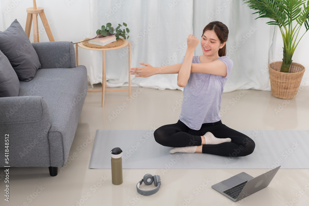 Yoga exercise concept, Young Asian woman stretching arms before workout ...