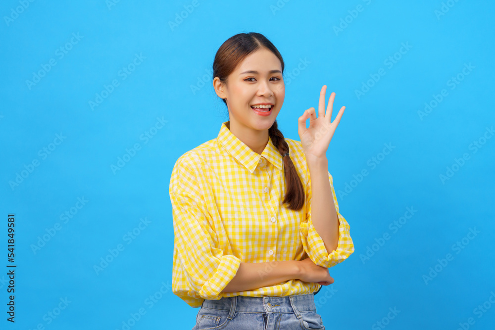 Women are doing gesture of ok sign while smiling and crossed arm on ...