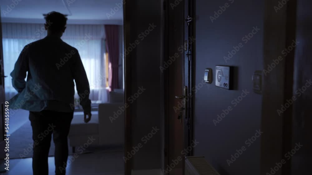 Energy-saving. The man who turns off the lamp holders saves electricity ...