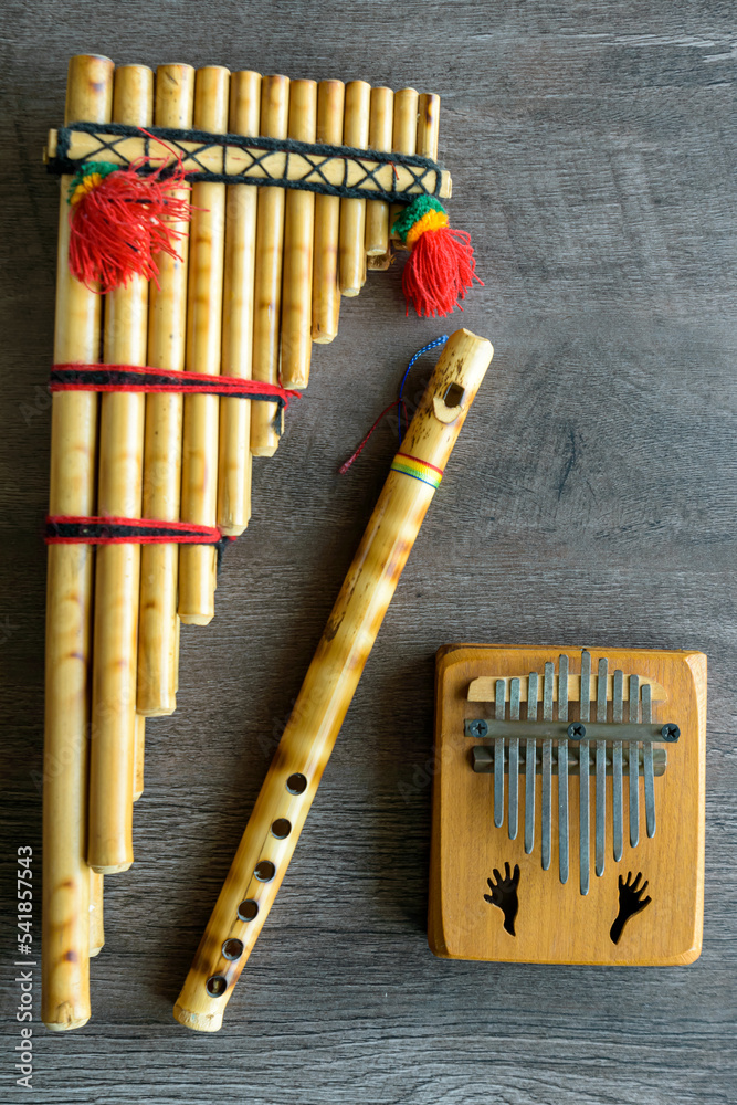 Indigenous musical instruments made of wood. Kalimba, flute and Siku ...