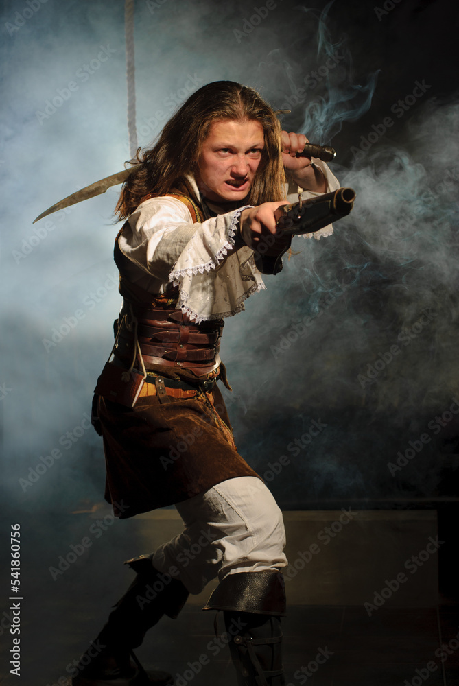Ferocious pirate sea robber with pistol and saber is preparing to ...