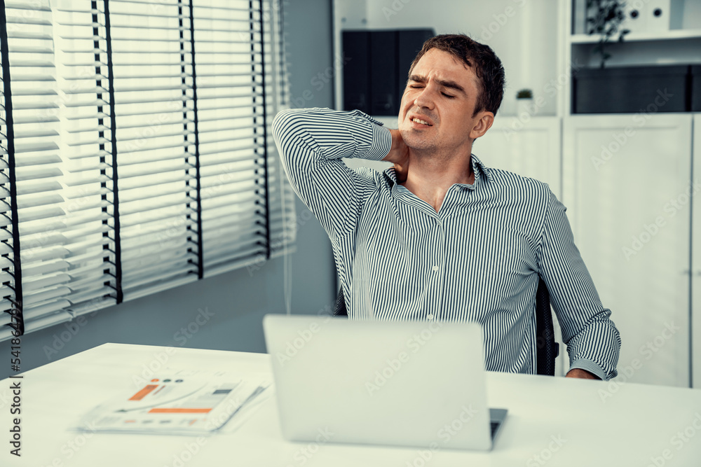 Competent office worker experiencing fatigue and neck pain. Unhealthy ...