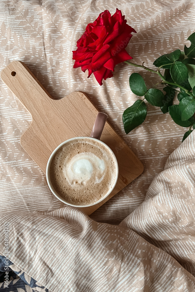 Top view of the morning breakfast in bed with cappuccino coffee on a ...