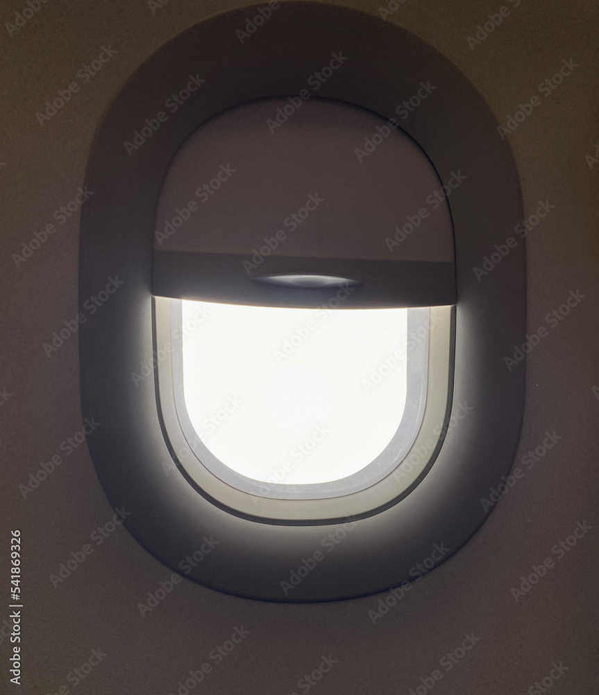 Sunlight coming through the airplane window, aircraft window with white ...