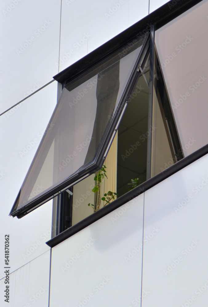 A slightly open window of the building on an autumn day Stock Photo ...